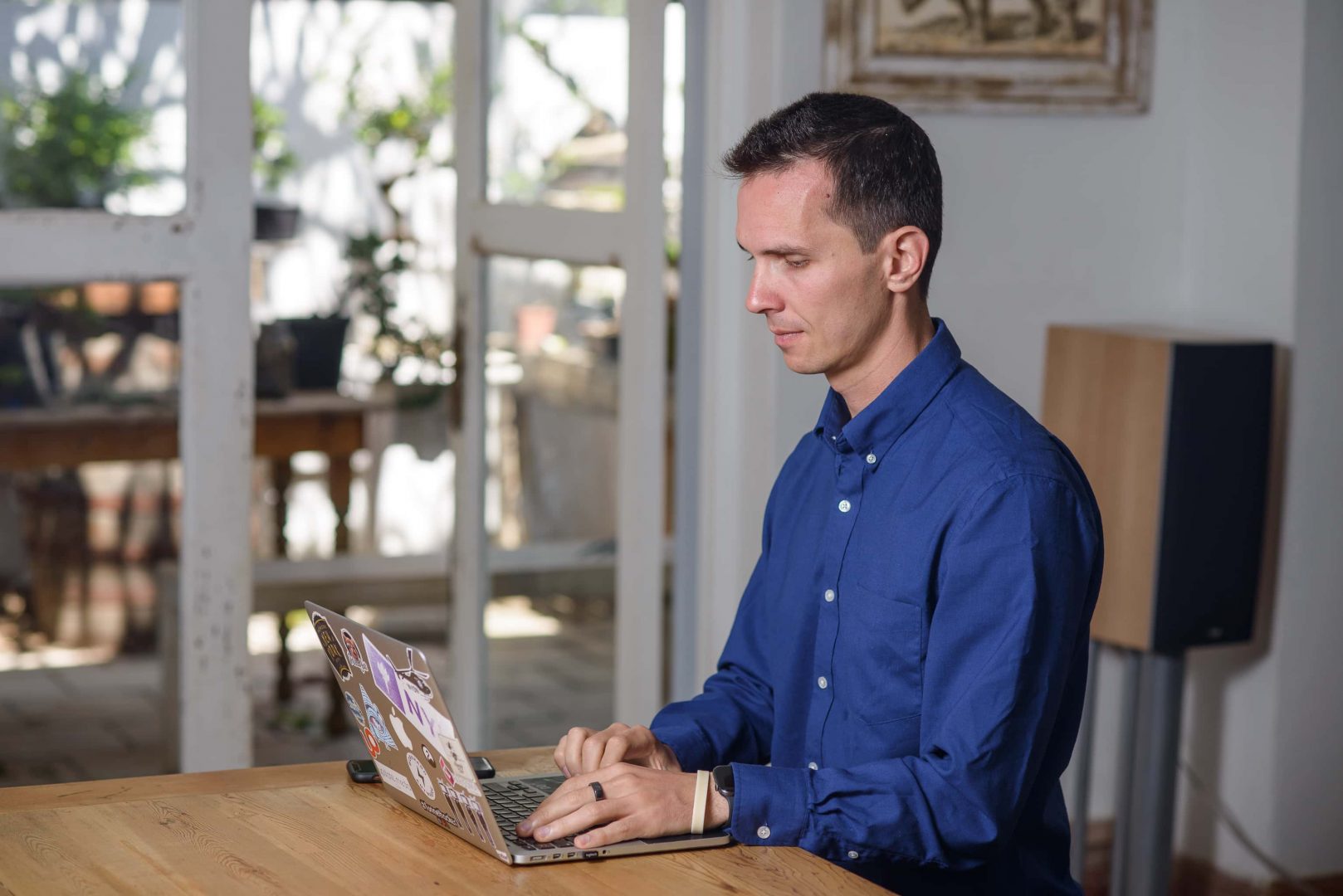 Max Grev Working on a MacBook — MGrev.com